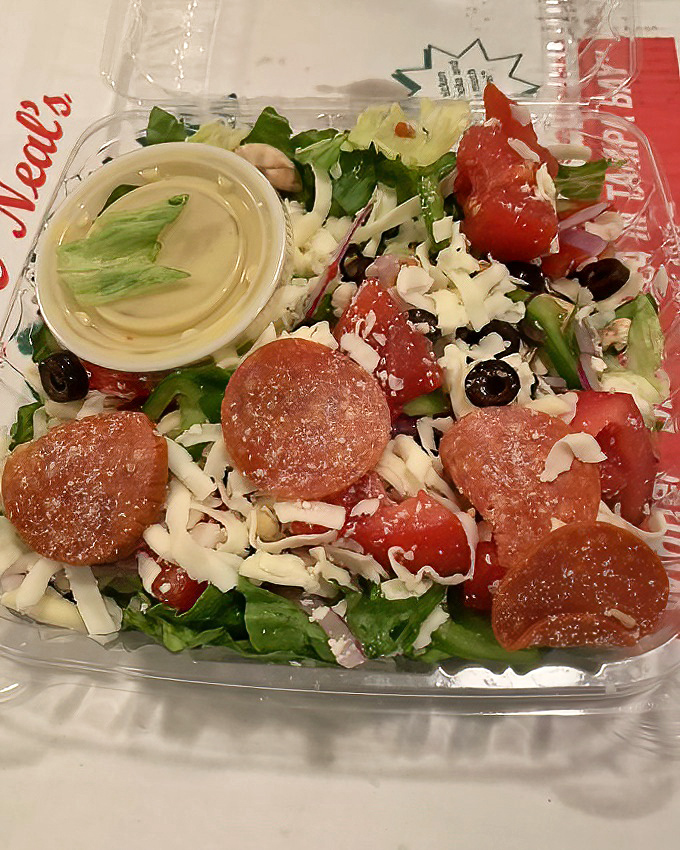Even their to-go salads look like they're dressed for success—pepperoni confetti included.