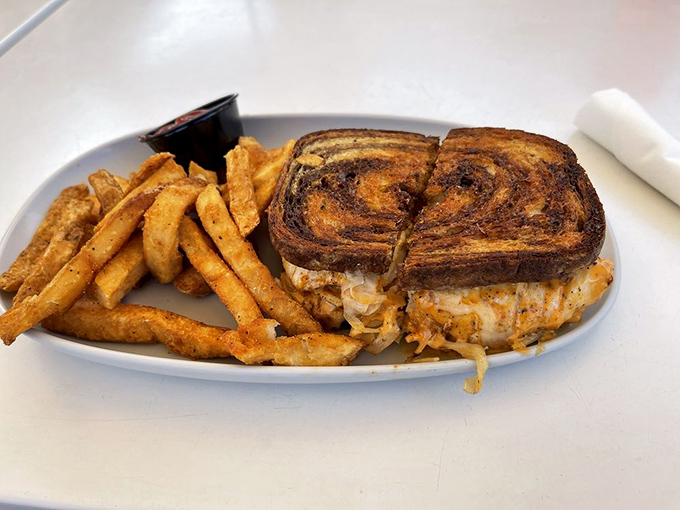 The Grouper Reuben brings together crispy bread, melted cheese, and tender fish—a sandwich that makes you wonder why you'd order anything else.