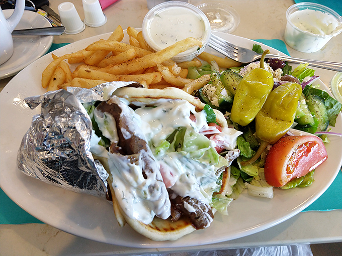 This isn't just a gyro—it's a Mediterranean vacation wrapped in warm pita, with tzatziki sauce that could make Zeus himself weep with joy.