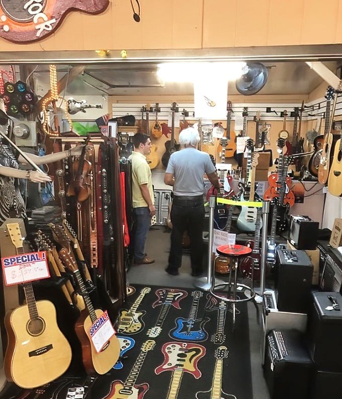 The guitar gallery where musical dreams begin. Instruments waiting for their next gig, whether it's a beachside jam or grandkid's first lesson.