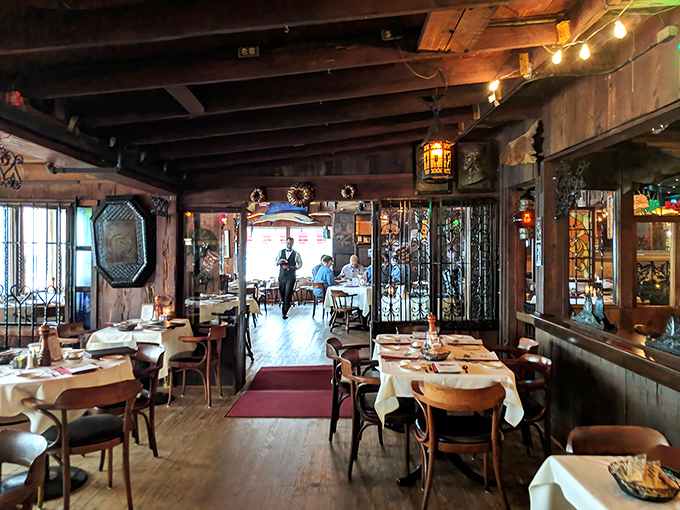 Rustic wooden beams and white tablecloths create that perfect "fancy but not fussy" atmosphere where both celebrations and Tuesday dinners feel right at home.