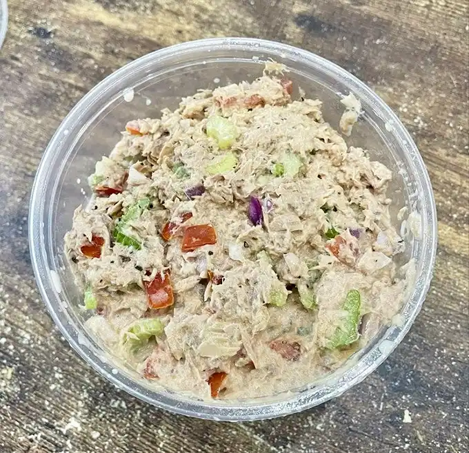 This tuna salad has nothing to do with the sad, mayo-drenched stuff your coworker microwaves. It's Mediterranean vacation in a plastic container.