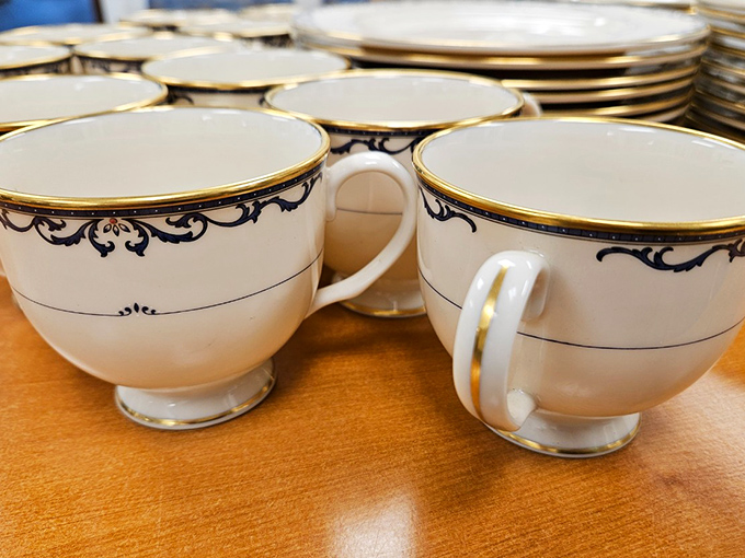 Elegant teacups with gold trim whisper of more genteel times. These aren't just vessels for caffeine—they're invitations to slow down and savor the moment.