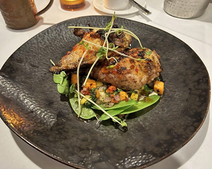 This isn't just chicken—it's poultry with purpose, perched atop a colorful medley of vegetables like it's posing for its Food & Wine cover shoot.