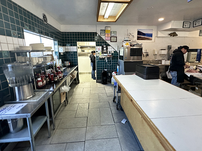 The kitchen—where the magic happens. Clean, efficient, and focused on transforming the morning's catch into the afternoon's delight.