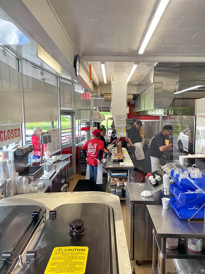 The kitchen ballet—where cooks perform the timeless choreography of flipping, frying, and serving that keeps loyal customers coming back for generations.