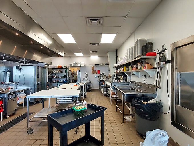 The kitchen where miracles happen daily—stainless steel and tile setting the stage for culinary alchemy.