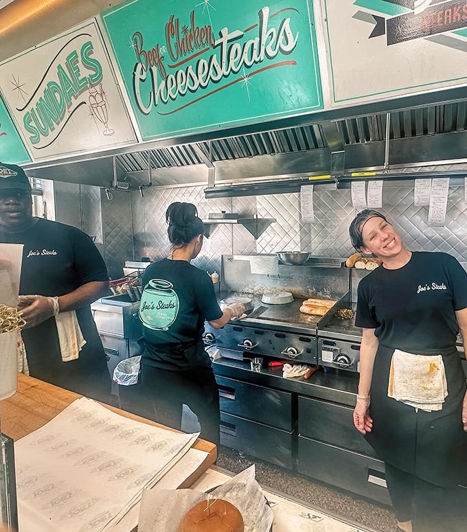 The kitchen – where magic happens at the intersection of sizzling grills, practiced hands, and Philadelphia tradition.
