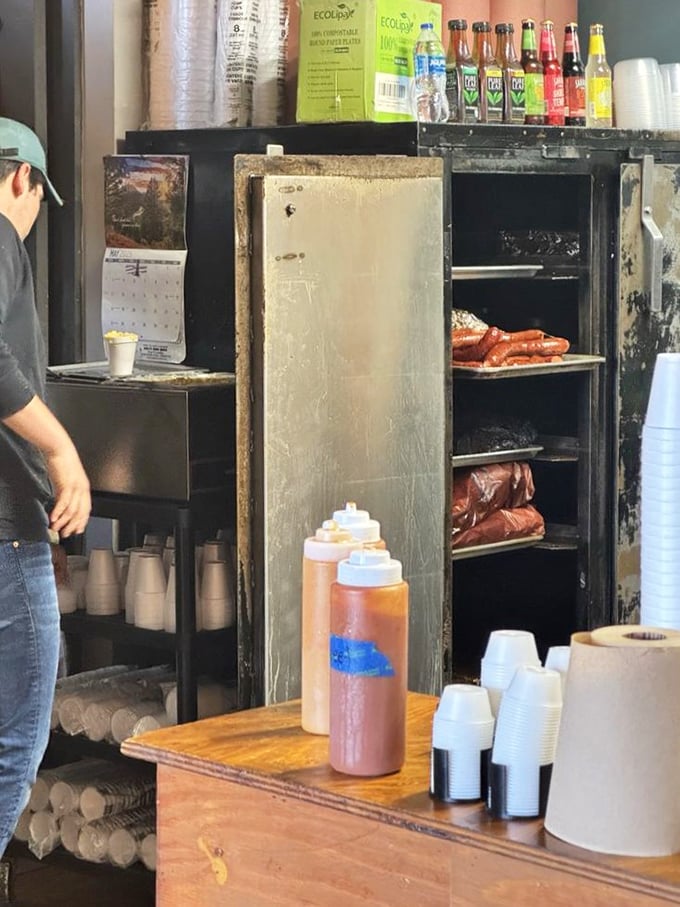 A glimpse into the inner sanctum where smoke works its magic. That well-seasoned smoker has stories to tell—all of them delicious.