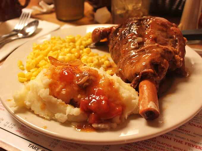 This lamb shank isn't just falling off the bone—it's practically filing for independence. Comfort food that makes you want to hug the chef. 