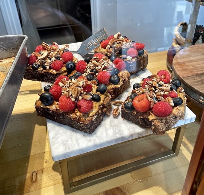Banana bread gets the royal treatment with fresh berries and nuts—like breakfast and dessert had a beautiful baby.