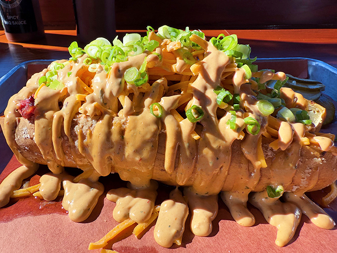 Not just a potato—it's a canvas for culinary creativity. Loaded with sauce, green onions, and enough cheese to make Wisconsin proud. 