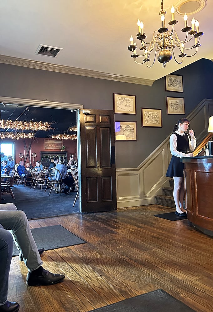 Historic charm meets modern hospitality at the entrance. That chandelier has probably witnessed more first dates than a movie theater.