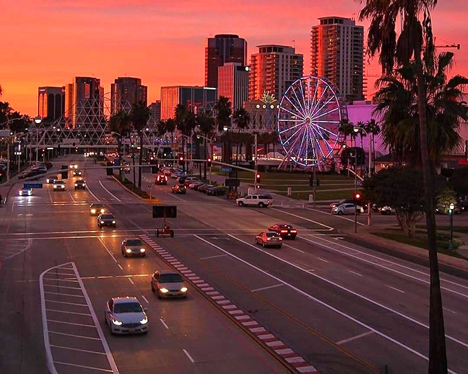 As the sun sets, Long Beach's skyline glows like a jewelry box filled with treasures, the Ferris wheel adding a touch of carnival magic.
