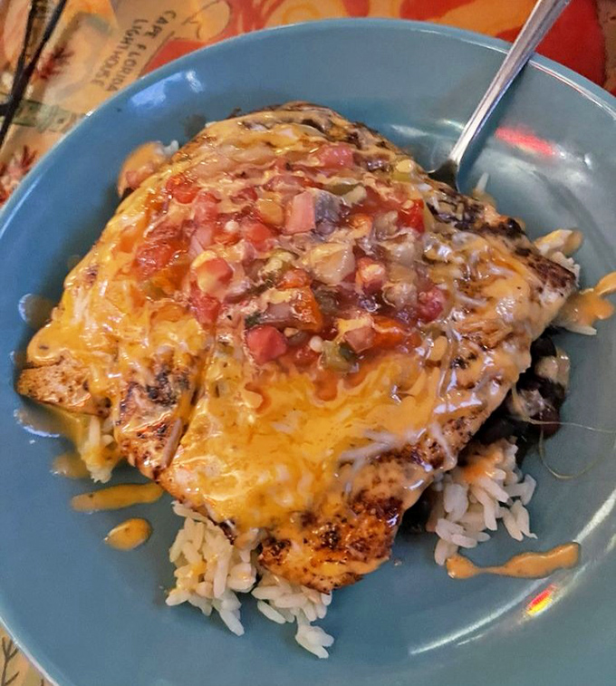 The Mahi Taco Bowl – where blackened fish meets melted cheese in a romance hotter than a Florida summer. Worth every delicious calorie.