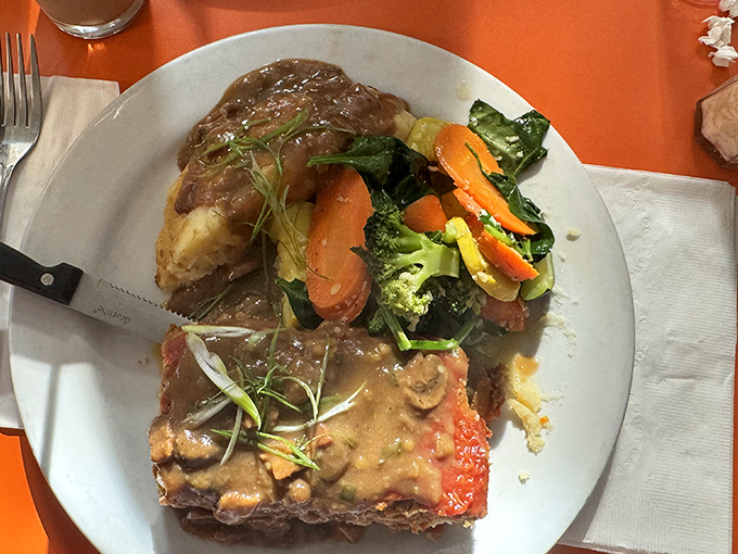 Meatloaf that doesn't apologize for being meatloaf, accompanied by vegetables that clearly weren't an afterthought. Comfort food with dignity.