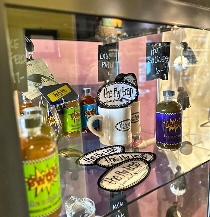 Hot sauce bottles and branded mugs aren't just merchandise—they're take-home talismans that let you bring a bit of Fly Trap magic home.