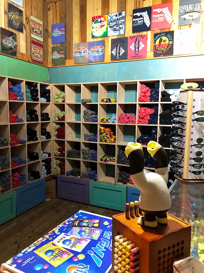 The merch corner proves people will buy anything to remember great food, with t-shirts that say "I came for the views but stayed for the coconut shrimp."