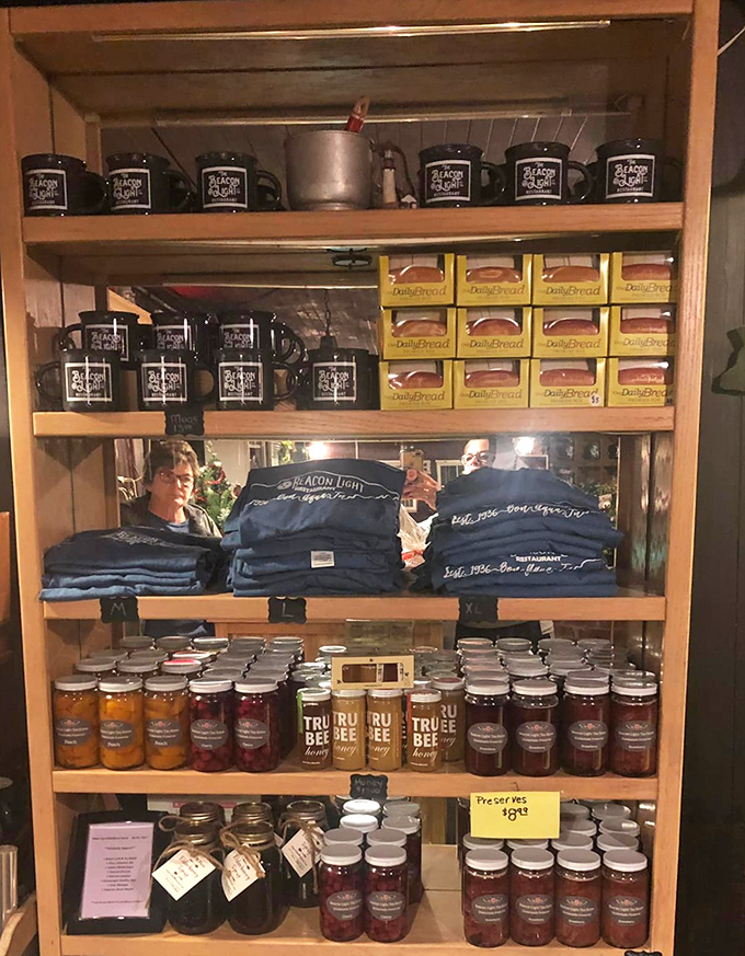 The ultimate souvenir shelf—branded mugs, homemade preserves, and t-shirts. Because the best vacation memories should be both wearable and edible.