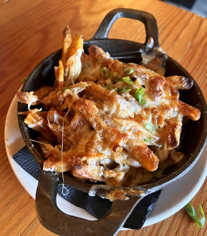 These aren't your average fries—they're a cheese-covered revelation that makes sharing nearly impossible, despite your best intentions.