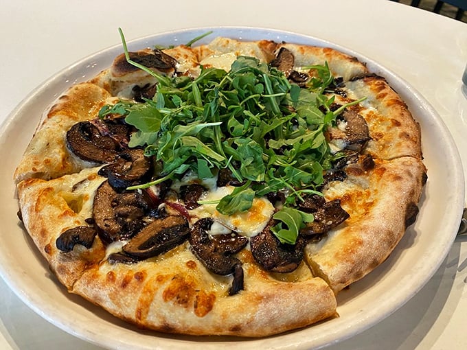 This isn't just a mushroom pizza—it's a fungi festival with a crispy, blistered crust that makes you want to high-five the pizza maker.