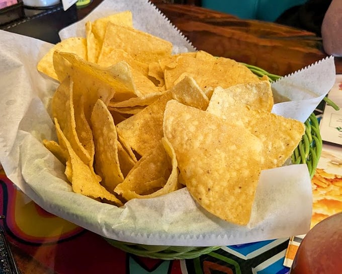 Nachos that crackle with freshness, stacked in their basket like golden tiles. They're not just appetizers; they're the opening act to a memorable meal.