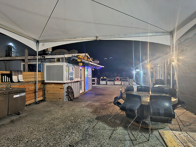 As evening falls, the patio transforms into a cozy harbor hideaway. Same great food, now with twinkling lights and the sound of gentle waves.