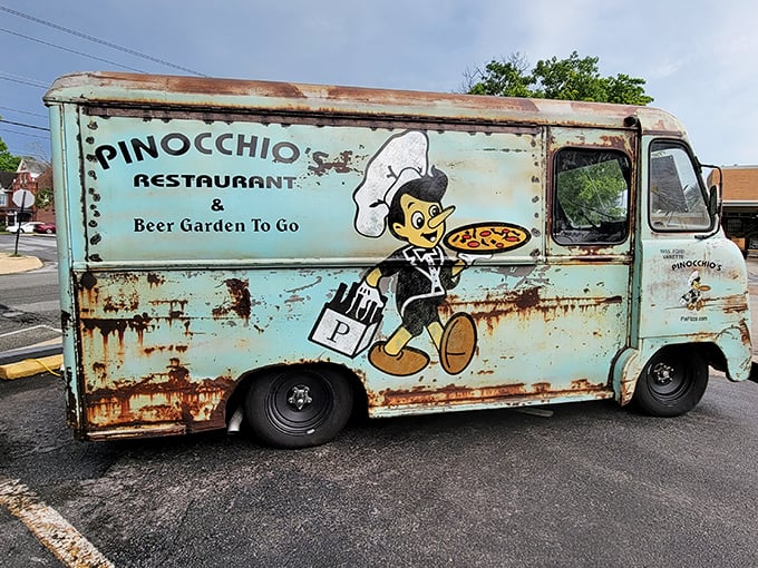 The vintage Pinocchio's truck—like finding a pizza time machine that somehow makes you hungry just by looking at it.