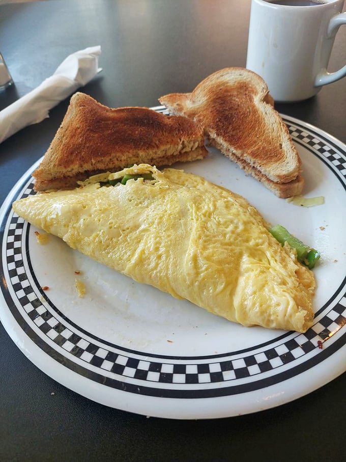 The perfect marriage: a fluffy omelet stuffed with veggies alongside toast that's achieved that elusive perfect golden-brown.