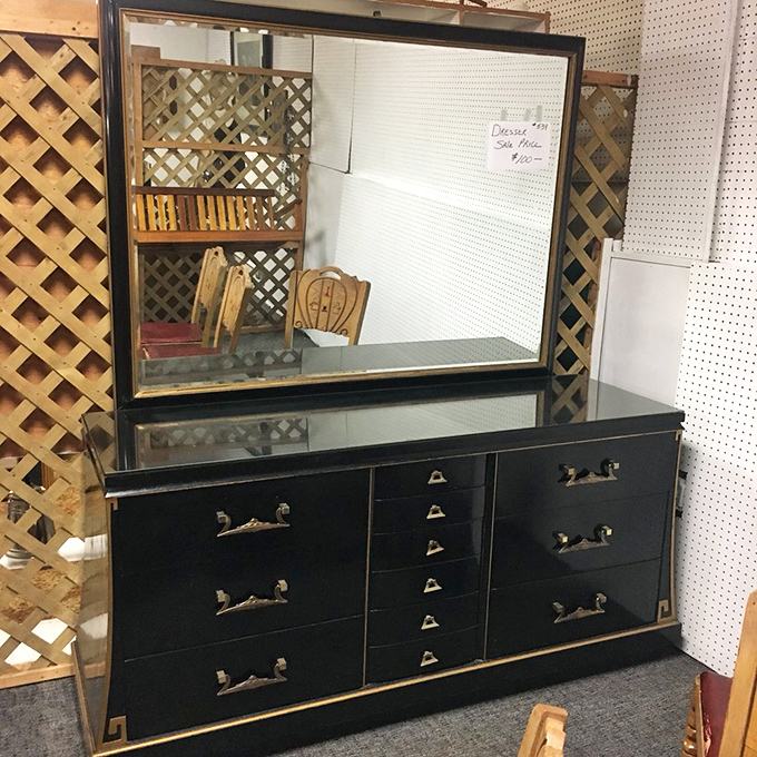 This dresser isn't just black lacquer and brass—it's Mad Men-era sophistication waiting to class up someone's bedroom with mid-century magic.