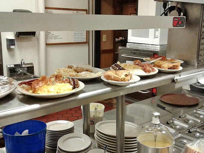 The open kitchen pass—where plates wait their turn to make someone's day better, one comfort food classic at a time.