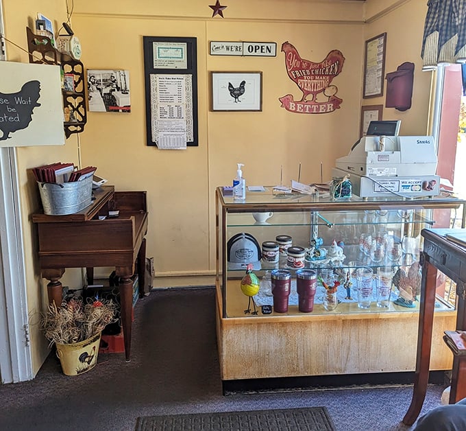 Chicken-themed décor and a sign declaring "We're Open"—two pieces of information that together form perfect happiness. The metal chicken seems to agree.