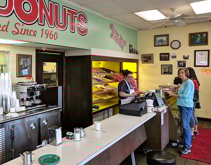 The moment of truth at the counter. That look of anticipation as your donut dreams are about to become reality is universal – somewhere between Christmas morning and winning the lottery.