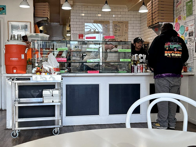 The counter where pizza dreams come true—simple, efficient, and focused on the craft. No pretension, just pizza perfection waiting to happen. 