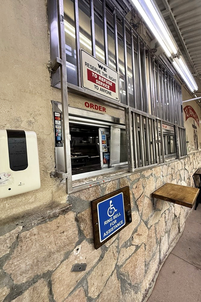 "We reserve the right to refuse service to anyone"—a sign that's been there so long it's practically part of the decor, like the stone walls themselves.