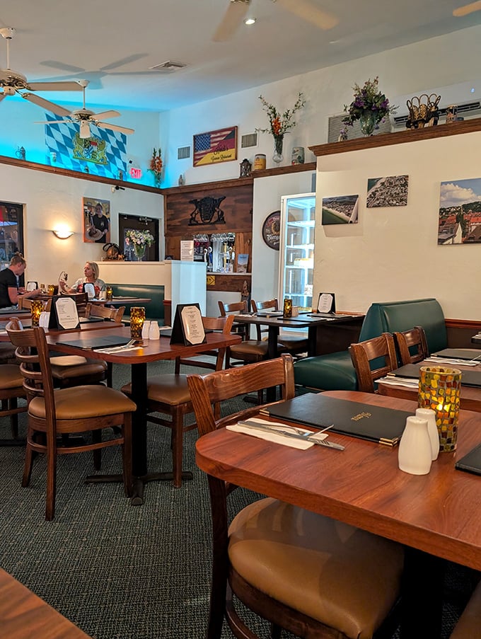 The Bavarian flag and cozy booths create that perfect "Gemütlichkeit"—that untranslatable German coziness that makes you want to stay forever.