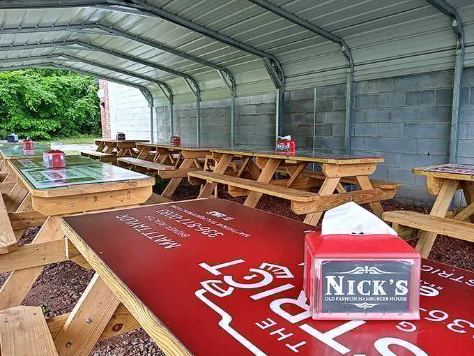 Outdoor picnic tables under cover – because sometimes a burger tastes even better with a side of fresh air.