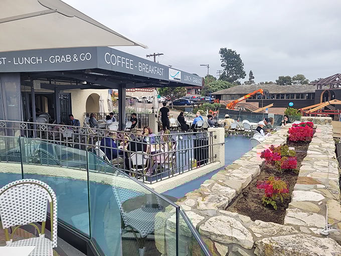 Pacifica Breeze Cafe's patio buzzes with the energy of locals and visitors alike, all united in the pursuit of good food with great views.