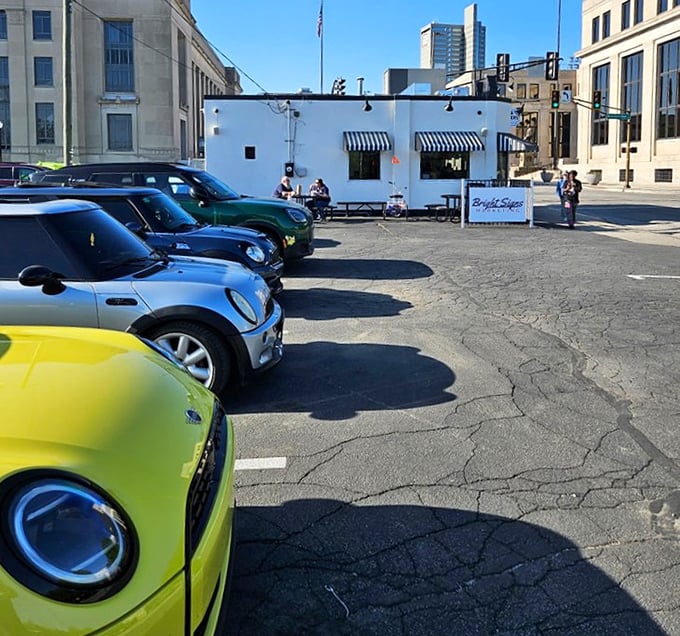 The parking lot fills with vehicles from all walks of life – luxury cars next to work trucks – because great burgers are the ultimate social equalizer.