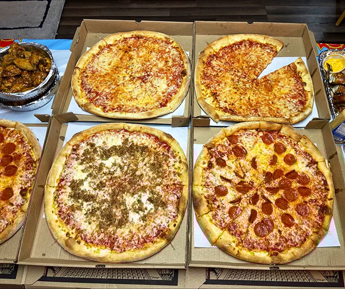 The pizza family portrait. From classic cheese to pepperoni perfection, each pie tells its own delicious story.