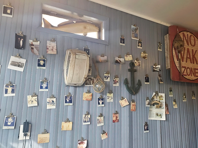 Customer photos cover the walls like a testament to countless satisfied appetites and happy memories.