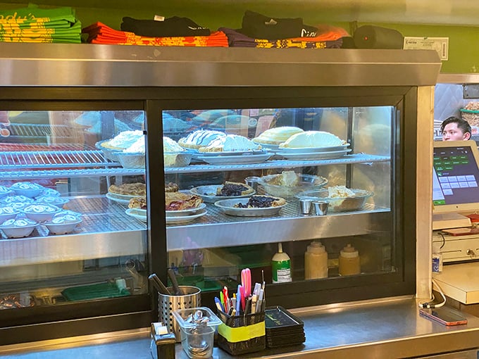 That pie case holds more temptation than a casino – each slice promising sweet salvation.