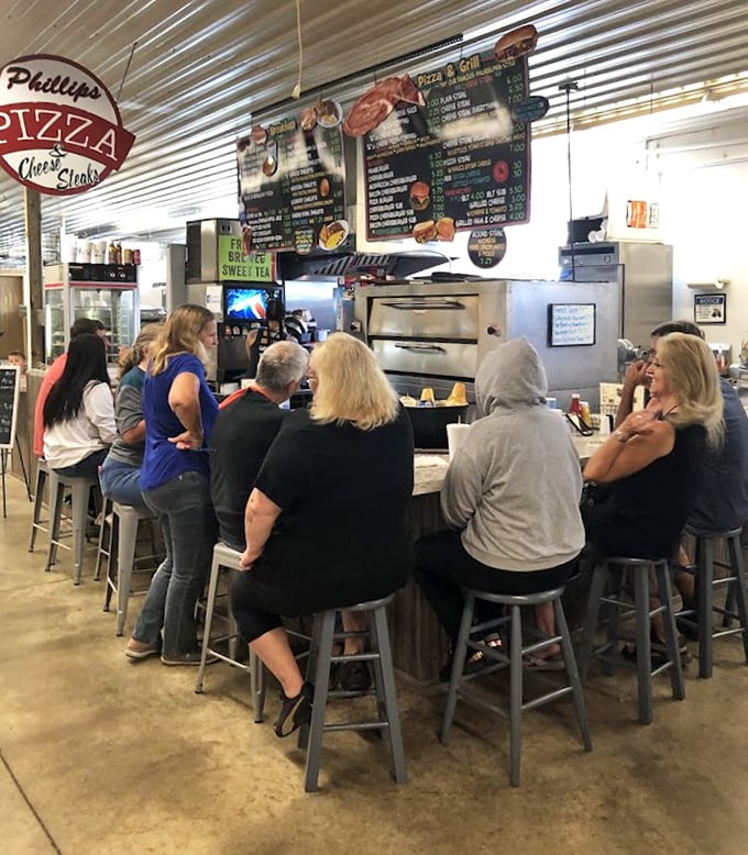 Phillips Pizza isn't just feeding stomachs—it's nourishing community. The counter seating turns strangers into neighbors faster than you can say "extra cheese."