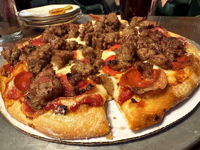 A pizza that doesn't need a passport to impress—topped with enough meat to make a carnivore blush with delight.