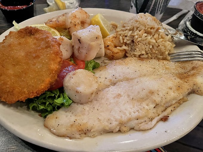 A seafood platter that answers the eternal question: "Why choose one when you can have it all?" The rice is just there for moral support.