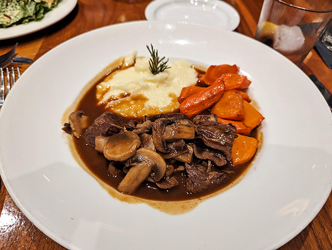 Julia would approve—tender beef bourguignon swimming in rich burgundy sauce with mushrooms that soaked up all the right flavors.