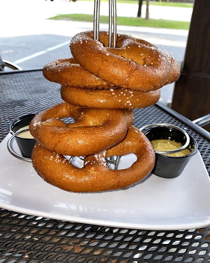 These pretzels have clearly been working out—stacked high, dusted with salt, and served with dipping sauces that make you wonder why plain pretzels even exist.