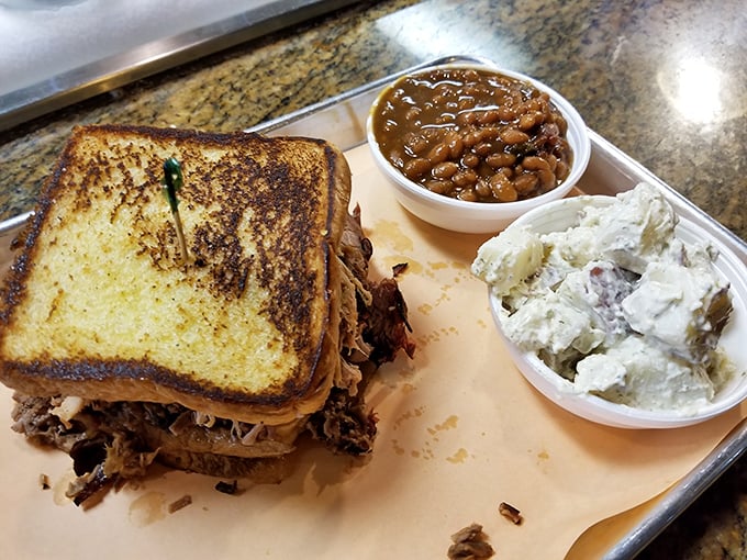 A pulled pork sandwich that requires both hands and several napkins—the kind of delicious mess that makes life worth living.