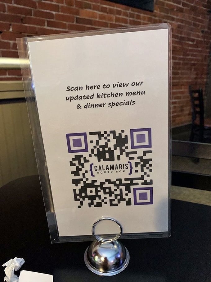 The modern meets the traditional—scan for the menu, stay for the brick wall ambiance that no amount of technology can replace.
