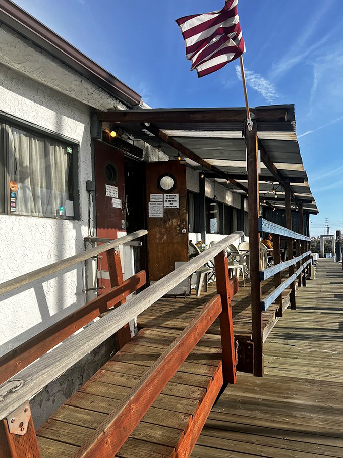 The gangplank entrance isn't just access—it's a transition from land to sea, from ordinary to extraordinary, from hungry to happy.